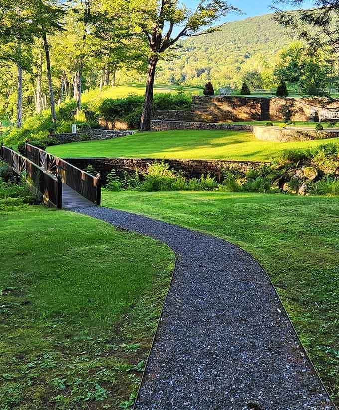 A gravel path curving gently through the green, the kind of walkway that makes you slow your pace without even realizing it.