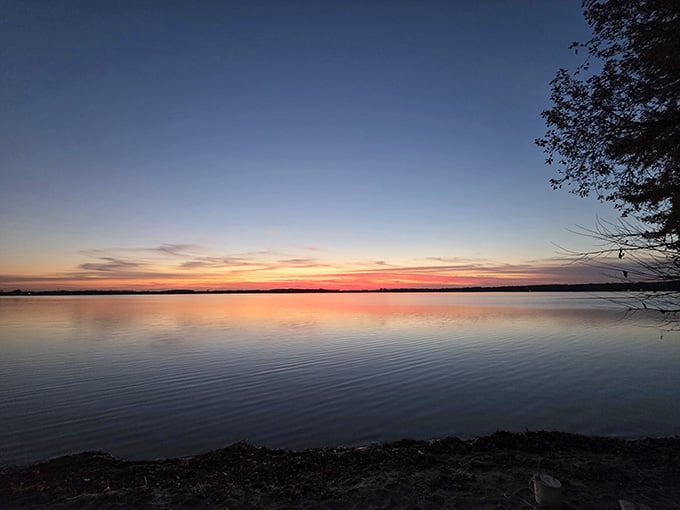 Dusk settles over the water like a soft blanket, painting everything in shades of coral and gold.