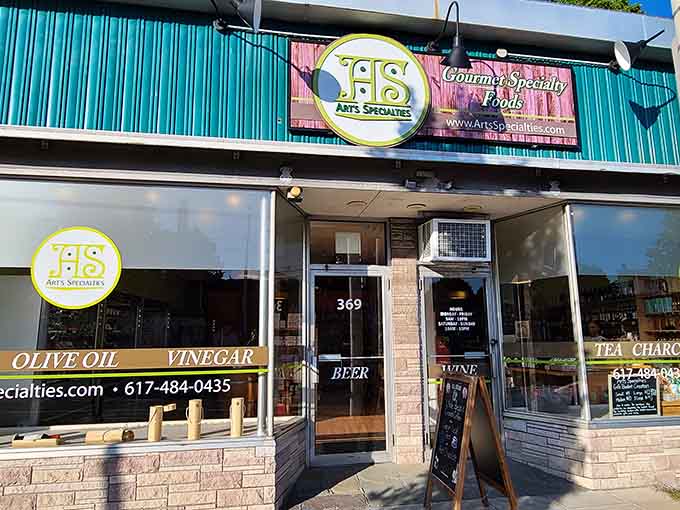 Specialty food shop storefront displaying olive oils and vinegars like liquid gold, because good ingredients matter to people here.