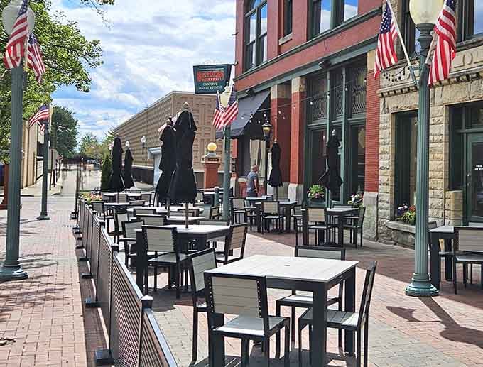 Brick sidewalks, American flags, and outdoor tables ready for a perfect Canton afternoon. Fresh air never tasted this good.