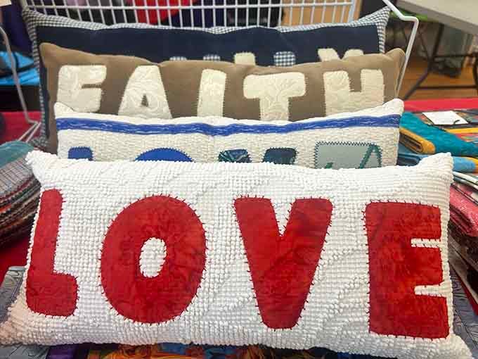Handcrafted accent pillows stitched with words like Love and Faith, because home decor can absolutely have a heart.
