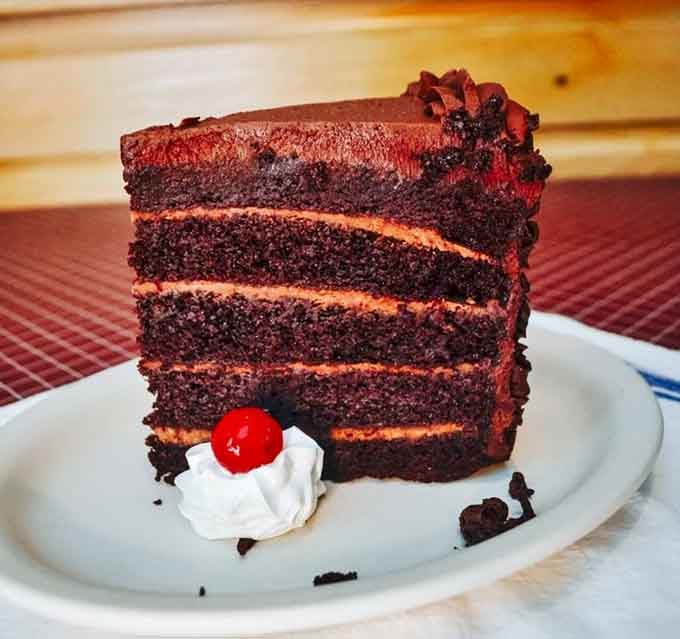 This towering chocolate cake has more layers than a good mystery novel and tastes infinitely better than reading.