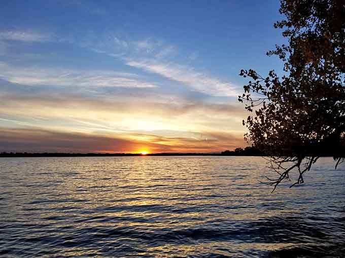 Big Stone Lake at sunset looks like someone turned the saturation up on the whole world and forgot to turn it back down.