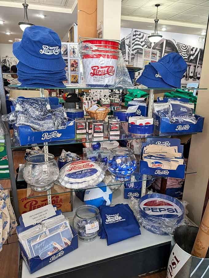 Bucket hats, tin buckets, trays, and cards. The Birthplace of Pepsi Cola gift selection is genuinely hard to resist.