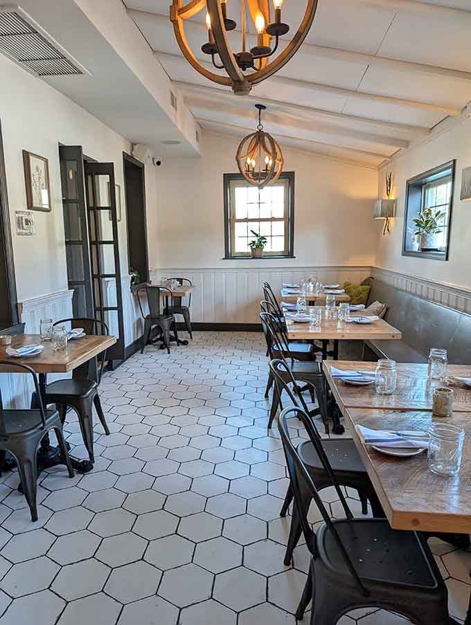 Hexagonal white tiles, rustic wood tables, and candle-style chandeliers. This cozy corner of Bloom is where great conversations happen naturally.