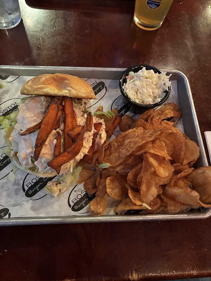 Sweet potato fries tucked inside a burger with coleslaw on the side, pure genius on a tray.