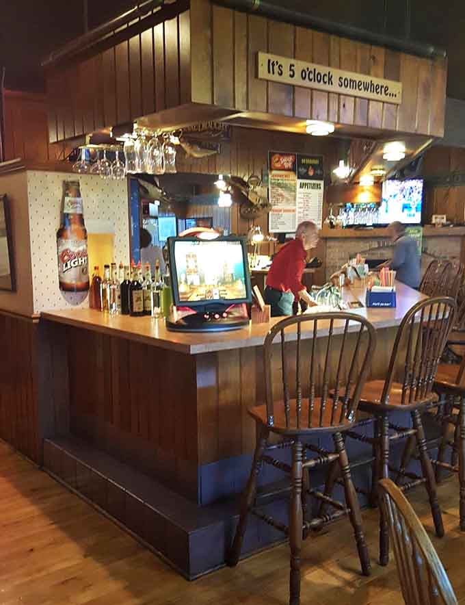 The bar sign says it's five o'clock somewhere. At the Branding Iron, that's less a motto and more a lifestyle.