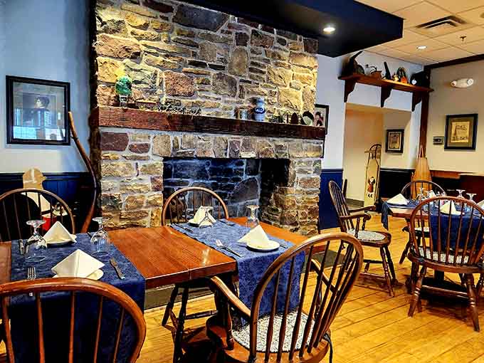 Blue tablecloths, framed artwork, and thoughtful lighting transform a simple dining room into somewhere you'll want to linger all evening.