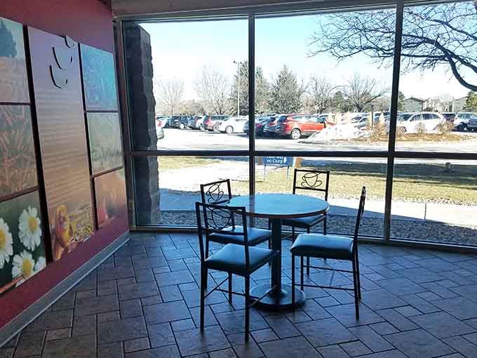 Sunlight pours through floor-to-ceiling windows onto a small caf&eacute; table, the perfect spot to sit and sip without a single care.