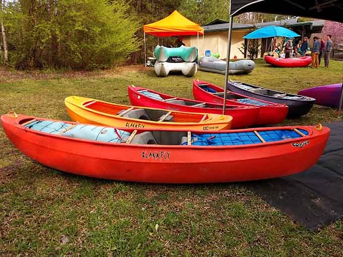 Canoes lined up and ready for adventure. The only question left is whether you're paddling toward calm water or something a little more exciting.