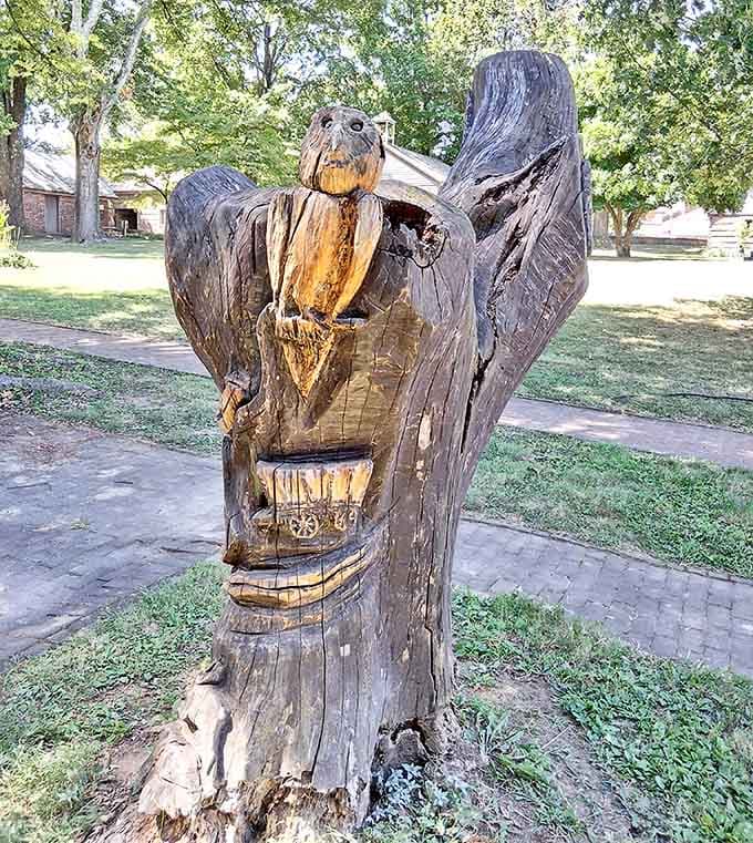 Even the chainsaw carvings here celebrate Kentucky's wildlife, adding whimsical touches to this serious historical site.