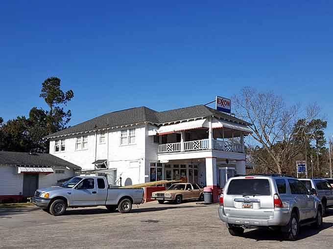 Pickup trucks, SUVs, and a two-story white building. The parking lot at Cooper's tells the whole story.