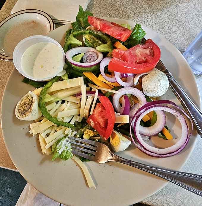 A salad loaded with cheese, hard-boiled eggs, tomatoes, and red onion. Proof that Crandall's doesn't cut corners anywhere.