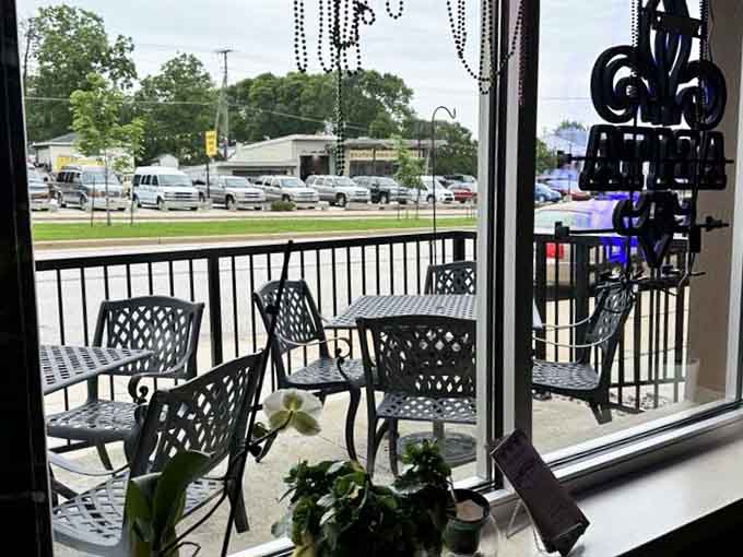 Cast iron patio chairs, Mardi Gras beads in the window, and a view of Greenfield Avenue. Not bad at all.