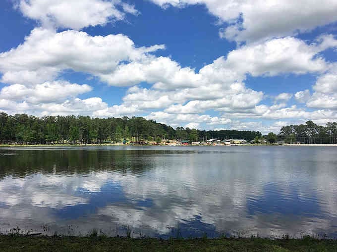 Mirror-perfect reflections on calm water under cotton-candy clouds create postcard views that no filter could possibly improve upon.