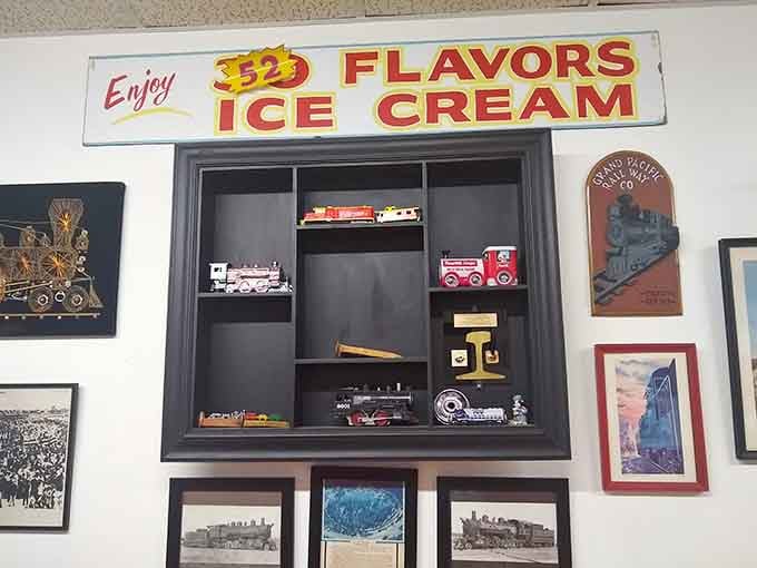 Miniature locomotives, a vintage ice cream sign, and railroad artwork &mdash; this display case is a museum and a sweet shop combined.