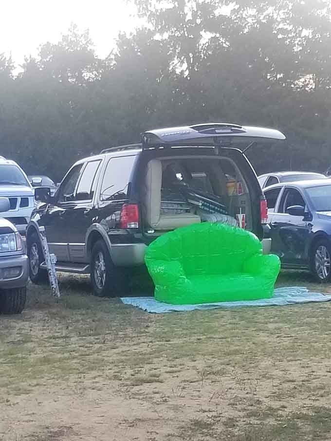 Someone showed up with an inflatable green couch, and honestly, that person deserves a standing ovation.