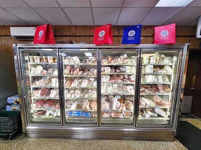 Four glass doors packed shelf to shelf with proteins — this freezer is basically a greatest hits collection.