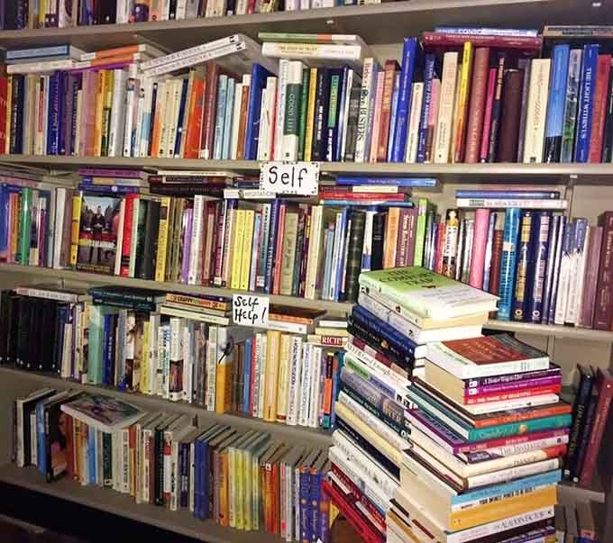 The Self Help section has actual stacks of books on the floor, suggesting everyone could use a little more help.