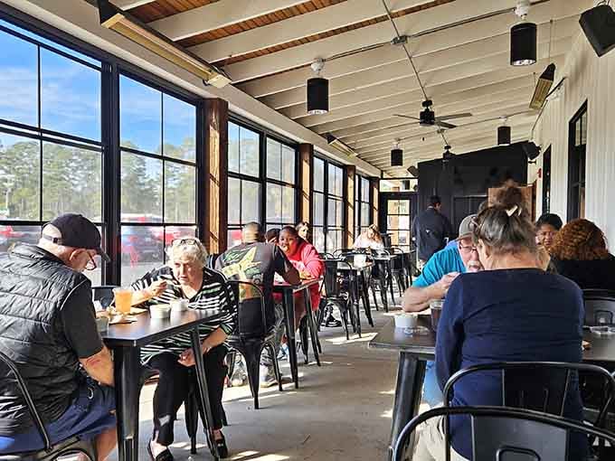 Sunlight pouring through floor-to-ceiling windows onto a buzzing patio, this is what a good afternoon looks like.