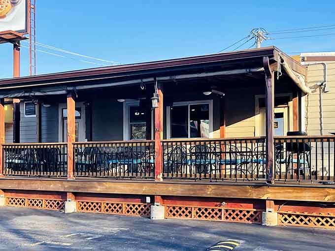 An outdoor covered porch with iron railings, the kind of spot where a lazy Sunday brunch becomes a full afternoon.