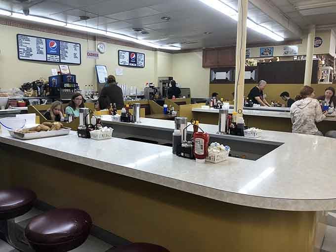 That long white counter is where good meals and unhurried afternoons have always belonged together.