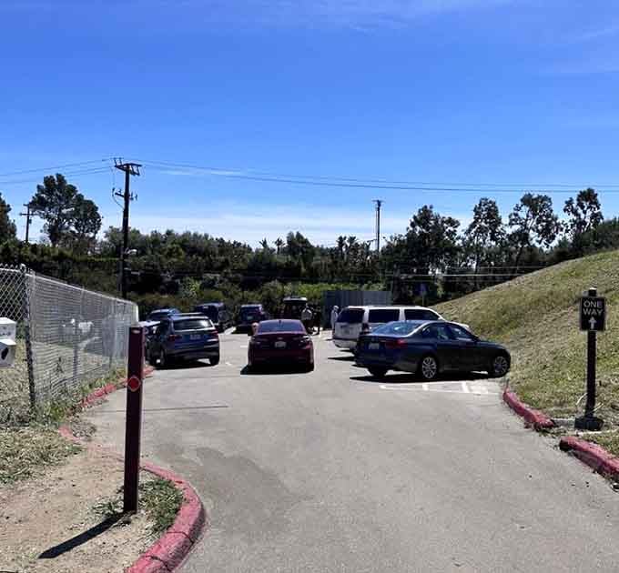 A busy parking lot under a cloudless Malibu sky signals that the secret about this trail is very much out.