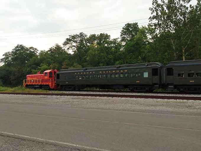 The Everett Railroad passenger cars glide past quietly, looking elegant and unhurried in the fading afternoon light.