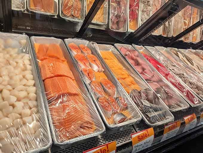 Salmon fillets, scallops, and fresh seafood cuts displayed beautifully. Your dinner plans just upgraded themselves without asking permission.