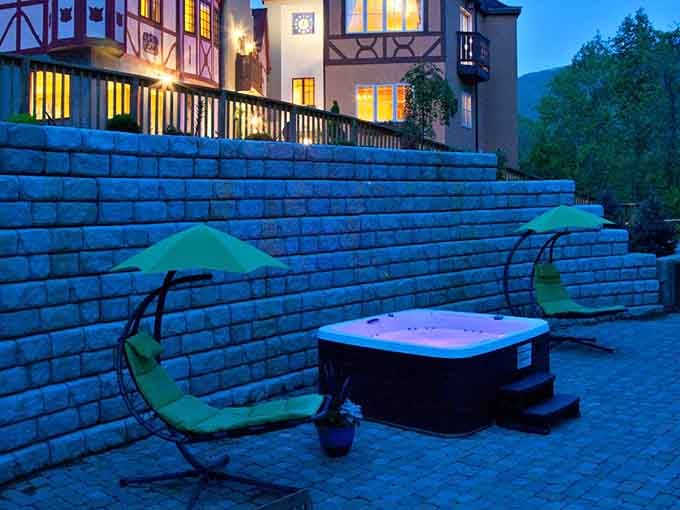 A glowing hot tub under the evening sky with the inn lit up behind you. Perfection, basically.