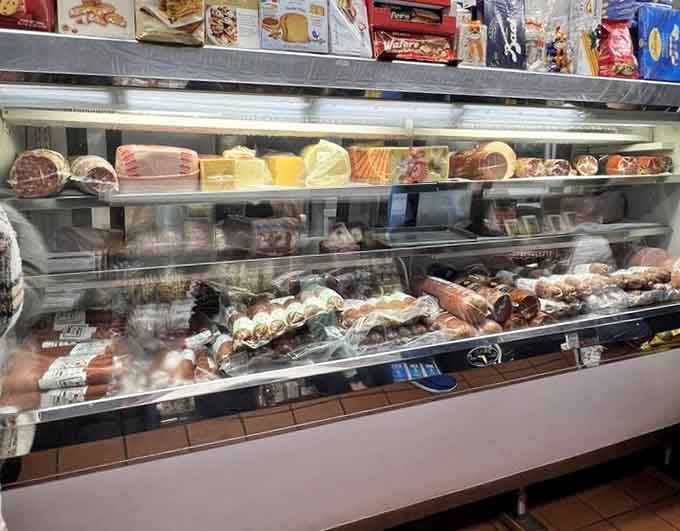 A deli case packed with enough cured meats and cheeses to make any Italian grandmother nod in proud approval.