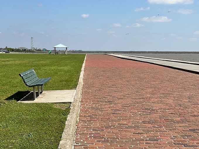 A brick path, a bench, and a view that makes every problem feel appropriately small and far away.