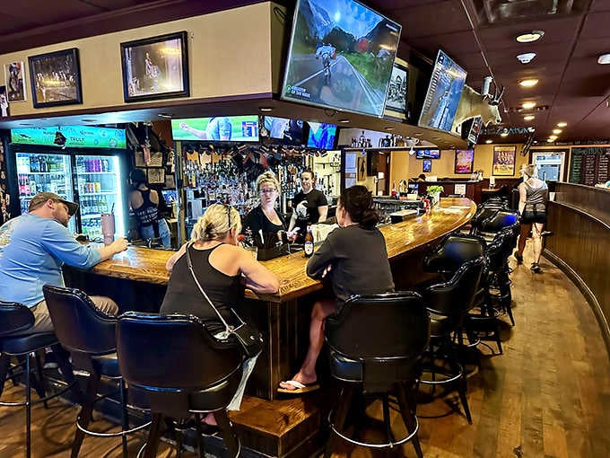 A curved wooden bar top, friendly bartenders, and cold drinks waiting. This is the universal language of a great night out.