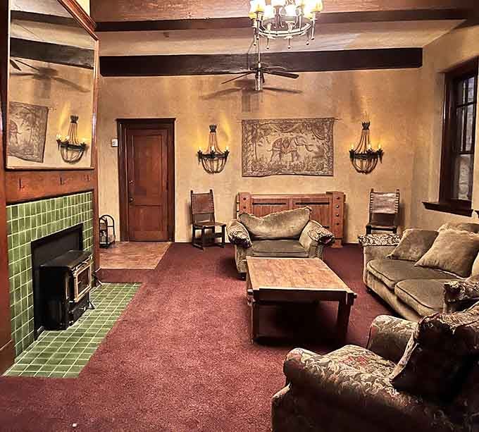 Living quarters decorated with period pieces and that unmistakable vibe that someone invisible might be sitting on that couch.