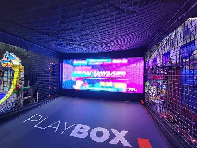 The Playbox interactive experience lights up like a portal to another dimension, and kids walk right in without hesitation.