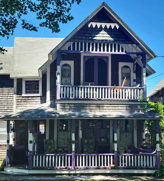 Dark shingles meet purple trim in a combination that somehow feels completely right. Bold choices, big rewards.