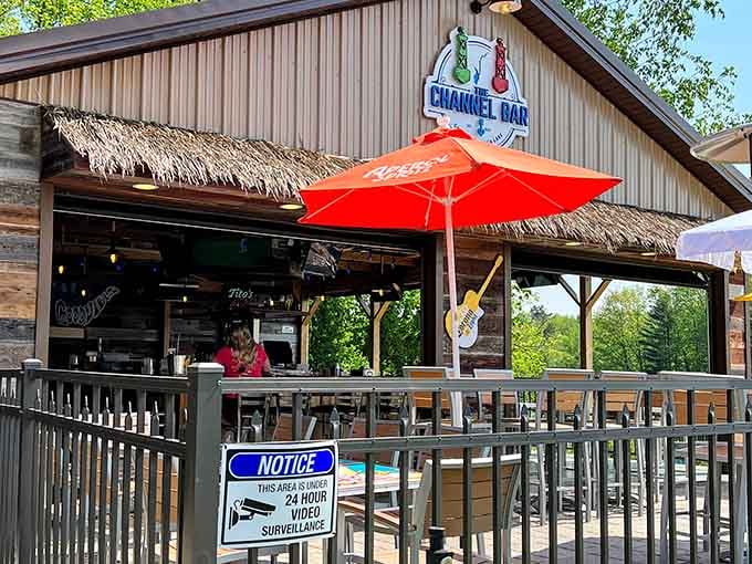 Tiki vibes meet lakeside dining under that cheerful red umbrella, vacation mode without the vacation prices.