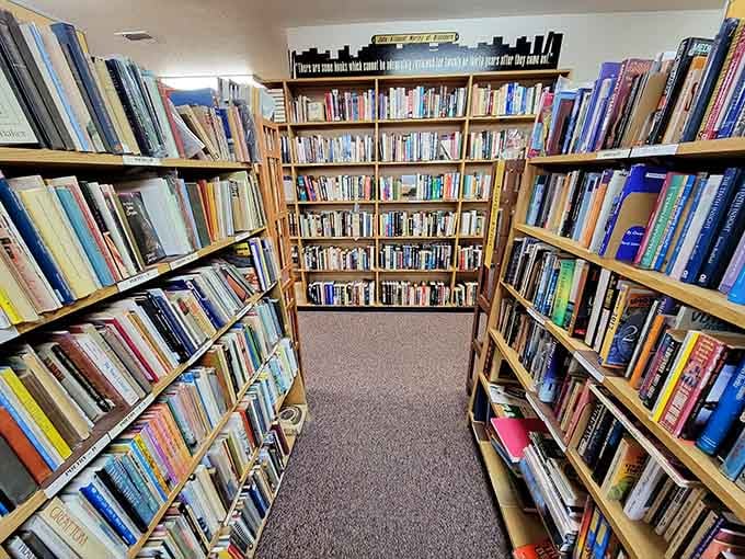 Long corridors of books stretching toward the horizon, with literary quotes painted above to keep you company along the way.