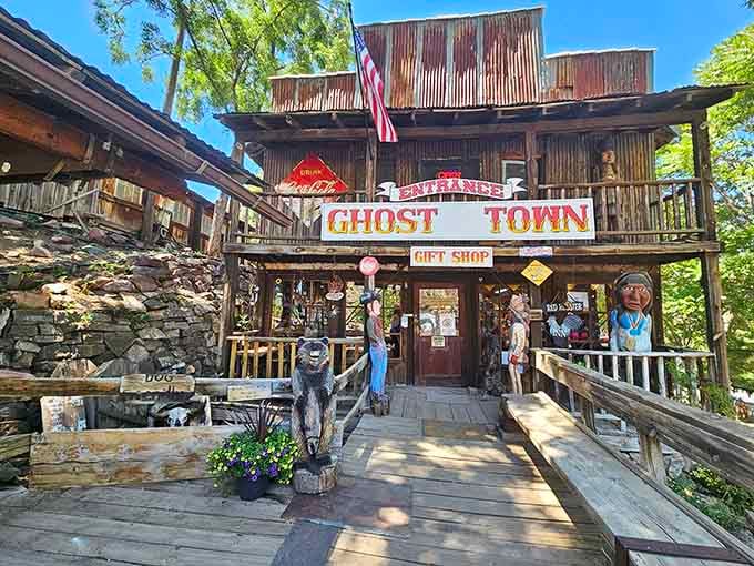 The gift shop entrance welcomes you with wooden cowboys and the promise of souvenirs worth actually keeping.
