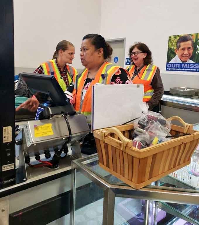 Staff in orange vests keeping things running smoothly, the unsung heroes behind every great bargain you'll find today.
