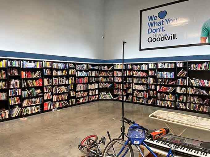 Wall-to-wall bookshelves packed with titles of every genre, with a bicycle and keyboard thrown in just to keep things interesting.