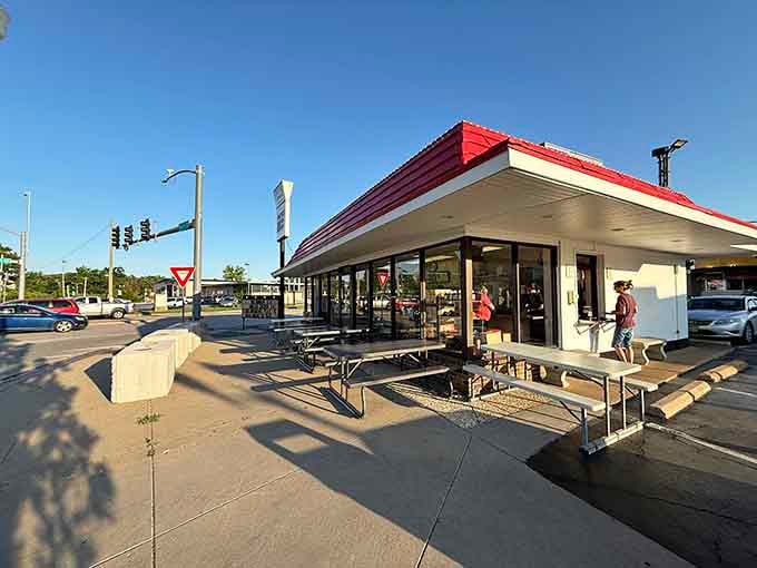 Picnic tables out front, blue sky above, and burgers on the way. Honestly, what more do you need?