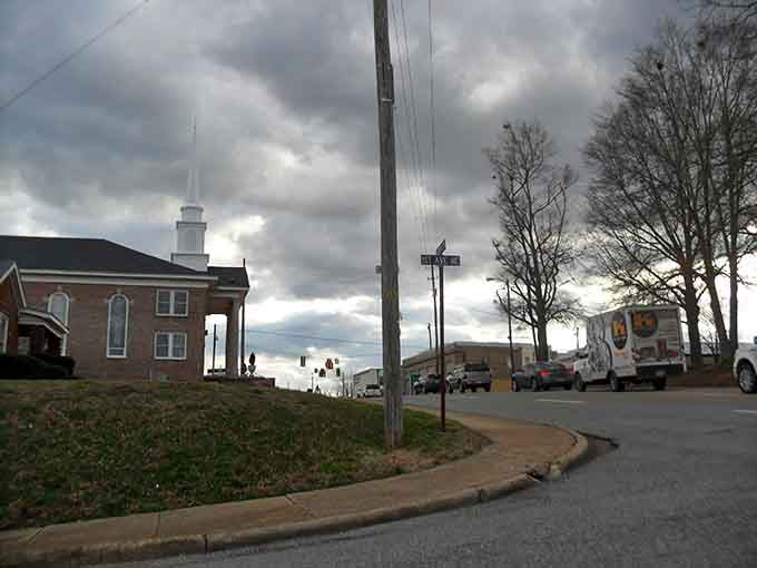 A church steeple, a curved street, and a moving truck, someone just made a very smart decision.