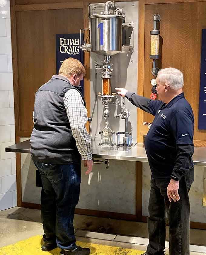 A guide walks a visitor through a miniature distillation setup. Learning has never looked this hands-on or this fun.