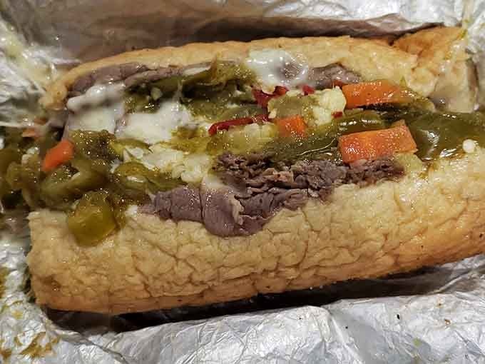 Tender Italian beef loaded with giardiniera and peppers, tucked into a soaked roll, this sandwich is Chicago's edible autobiography.