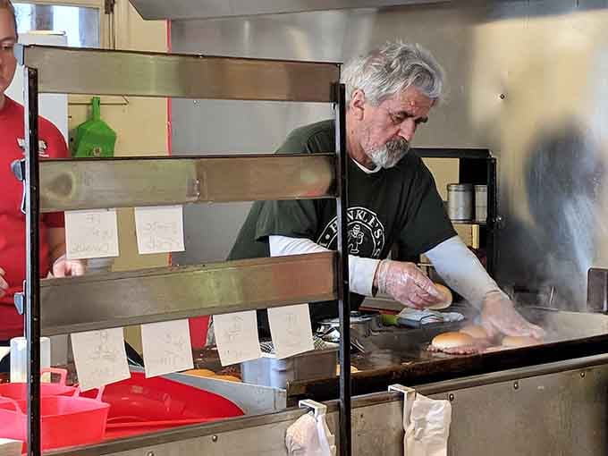 Behind every great smashed burger is someone working a hot griddle with quiet, focused dedication. This is that person.
