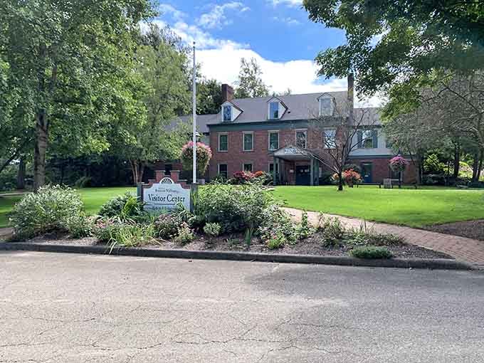 The Roscoe Village Visitor Center greets you with flower-lined paths and a welcoming brick facade that means business, the good kind.