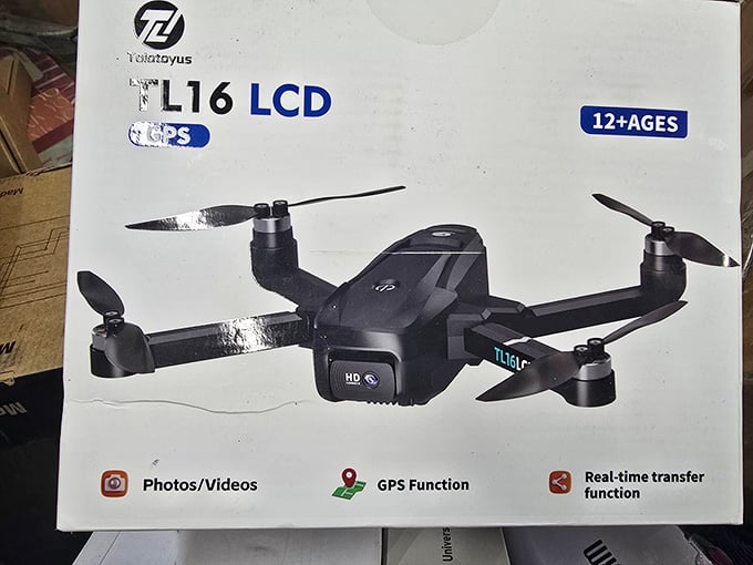 A GPS-equipped drone with HD camera sitting right there in the bins, this is the find that makes the whole trip worthwhile.