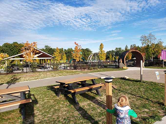 Picnic tables positioned perfectly for watching the chaos unfold while pretending you packed healthy snacks.