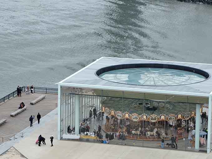 From above, the pavilion looks like a gift box someone left on the Brooklyn waterfront. What's inside? Everything.